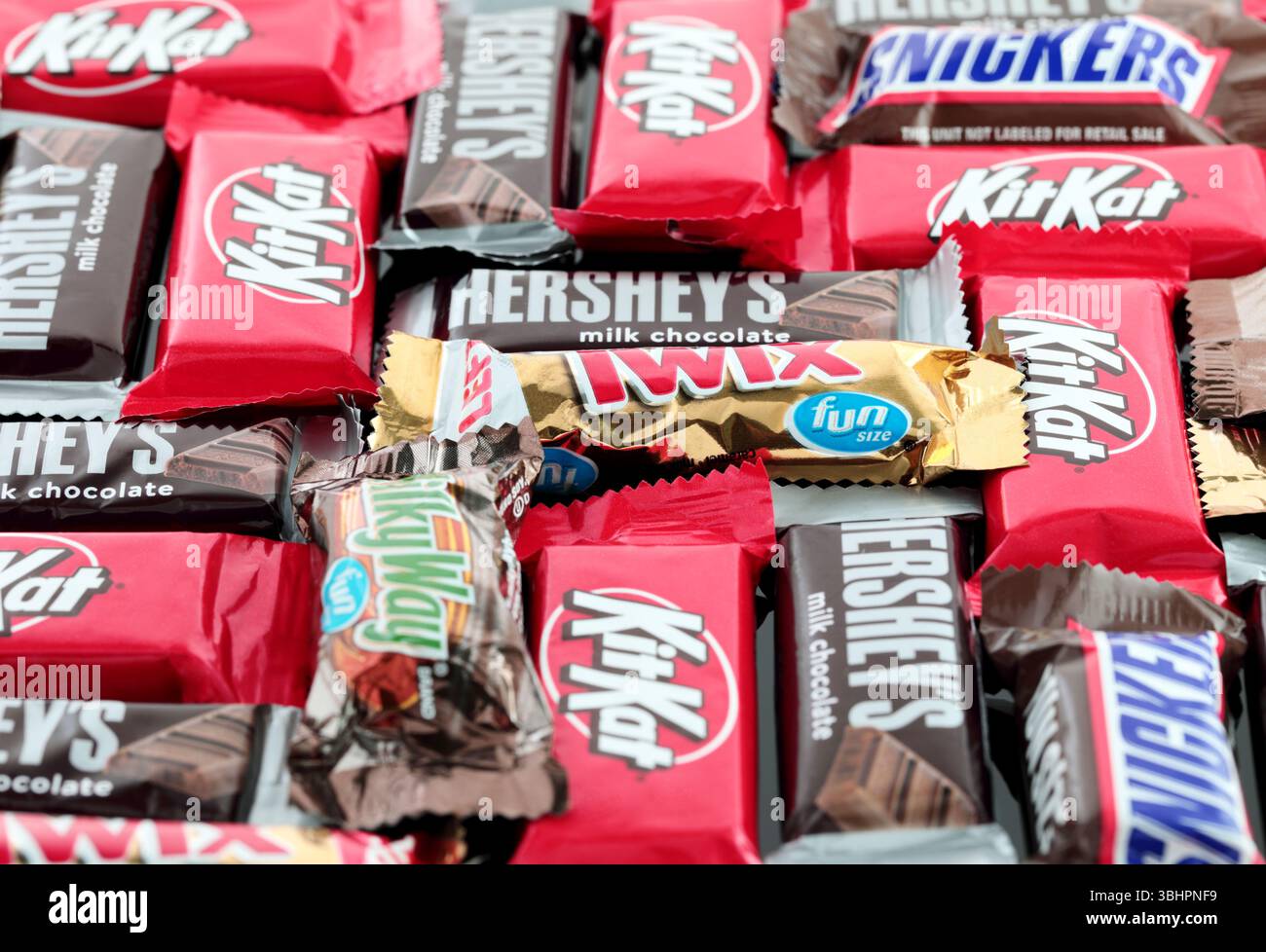 Background of Chocolate bars Mix in a packages: Kit Kat, Snickers, 100 ...