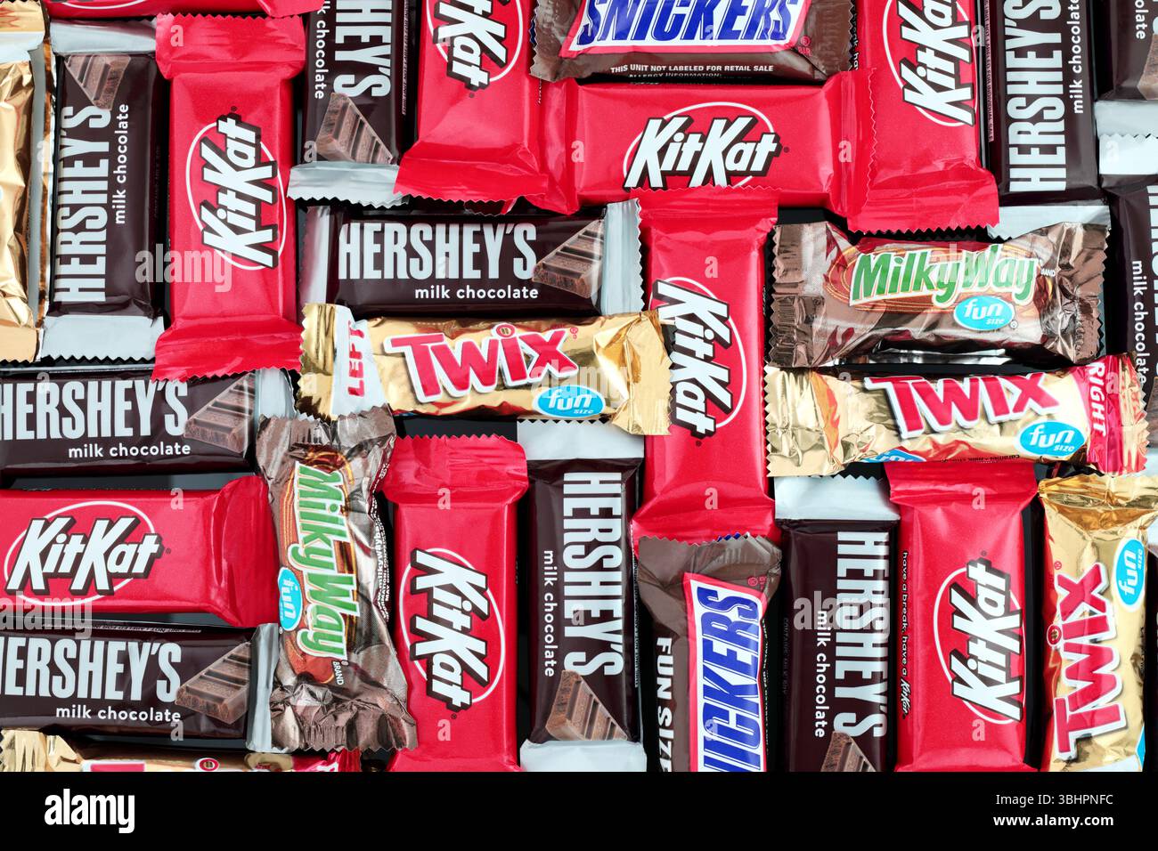 Background of Chocolate bars Mix in a packages: Kit Kat, Snickers, 100 ...