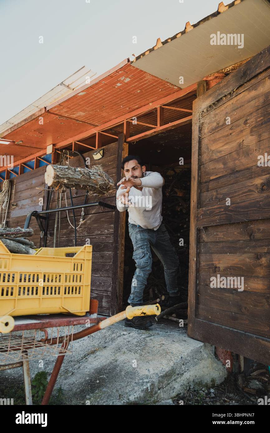 Boy loads wood wheelbarrow hi-res stock photography and images - Alamy