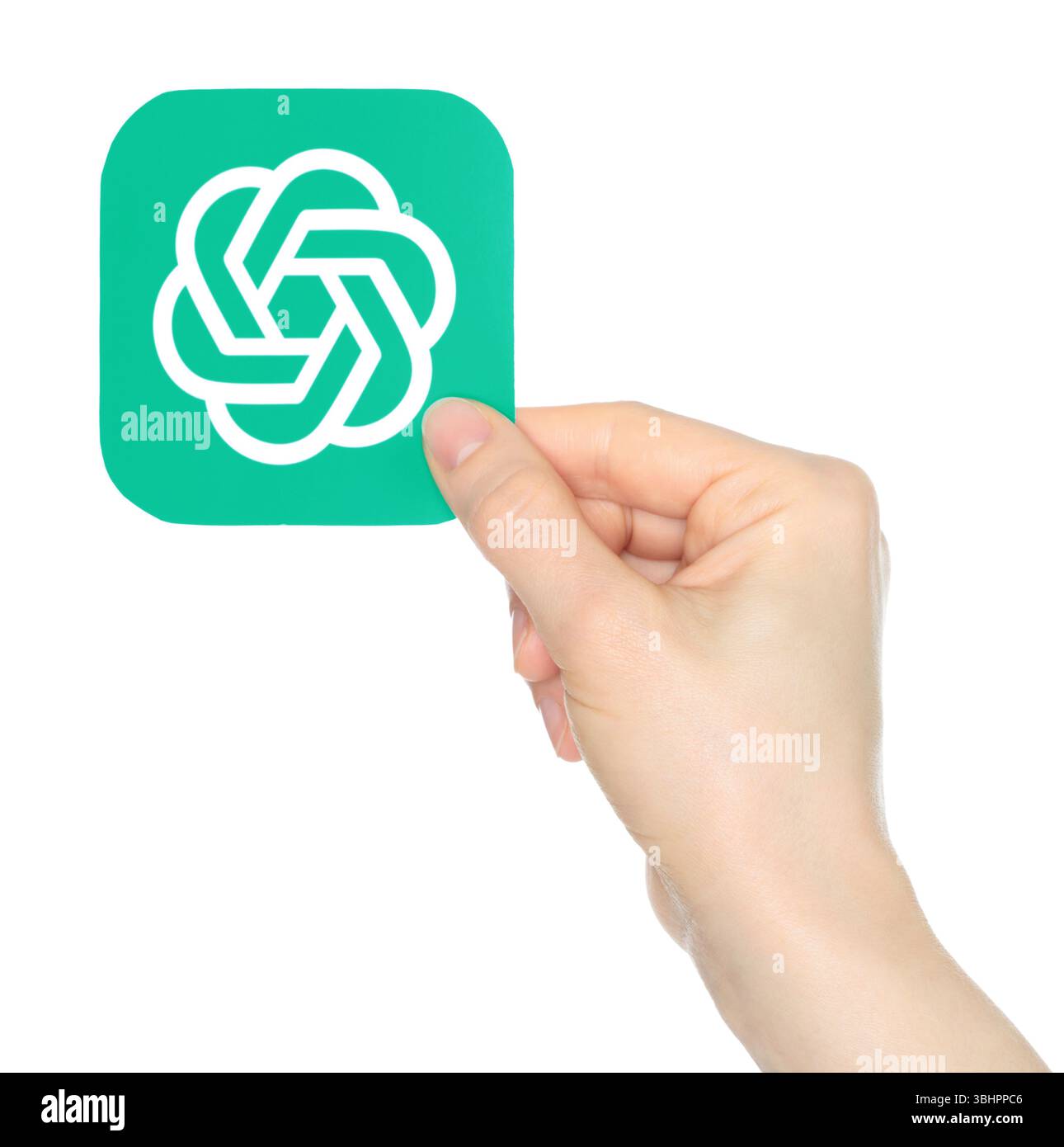 Hand holds paper OpenAI ChatGPT mobile app icon, on a transparent ...