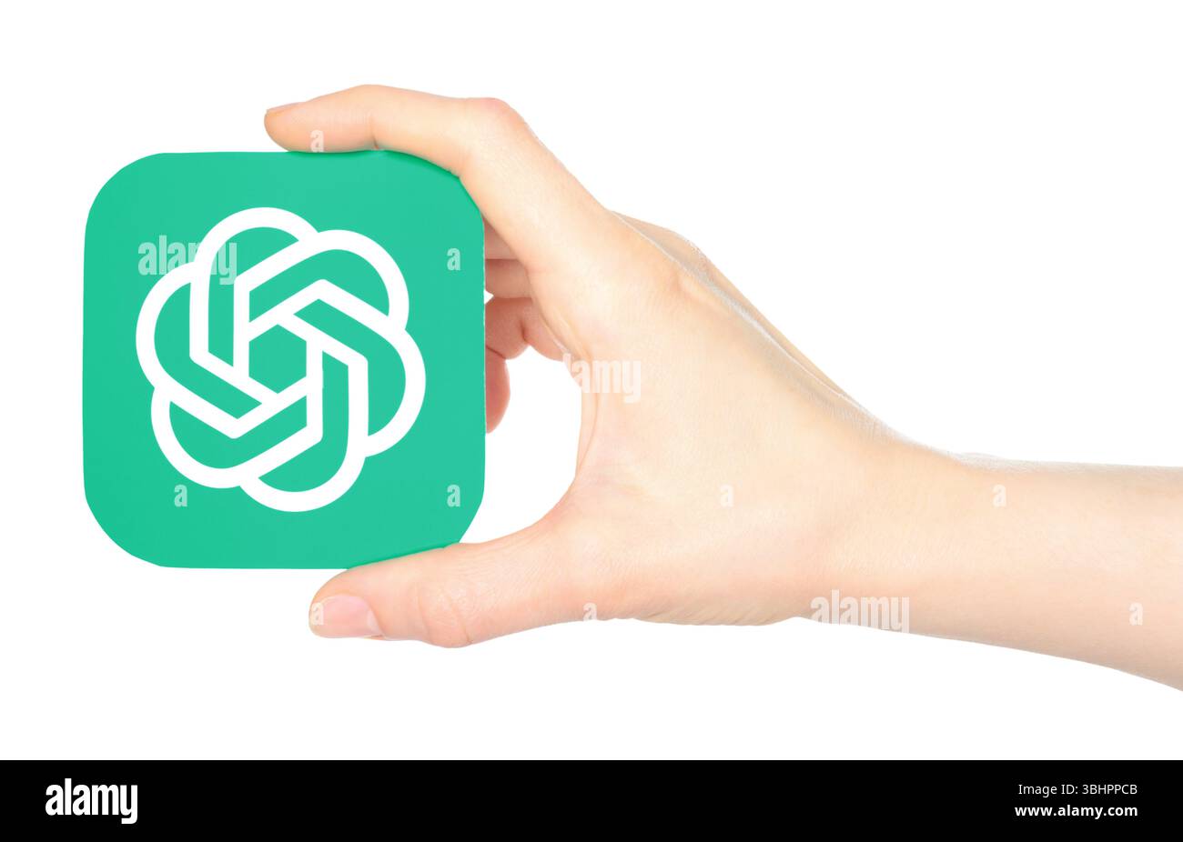 Hand holds paper OpenAI ChatGPT mobile app icon, on a transparent ...