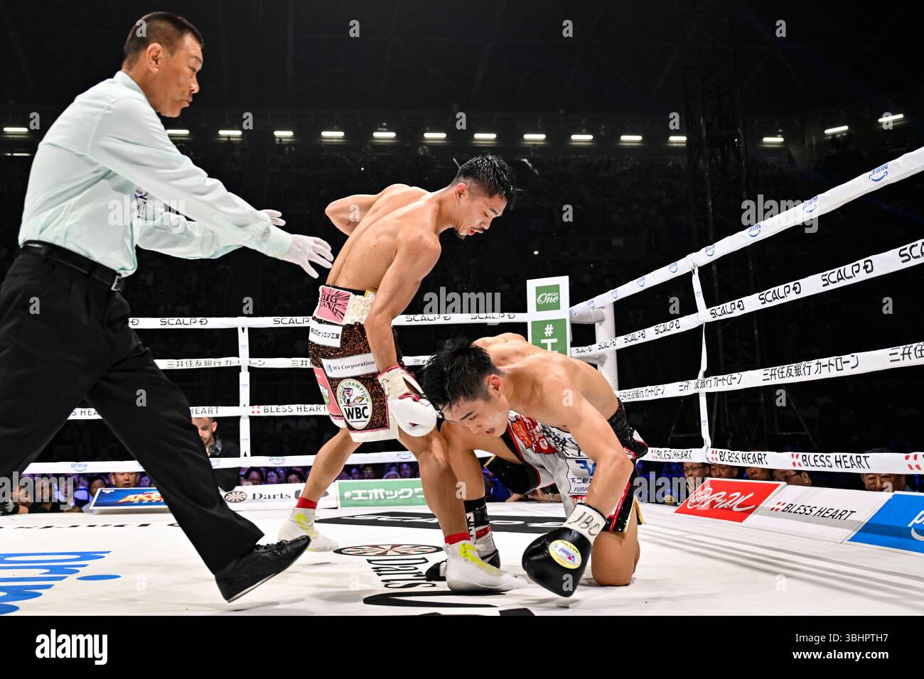 Junto Nakatani (white gloves) and Ryosuke Nishida (black globes) compete during their WBC and ...