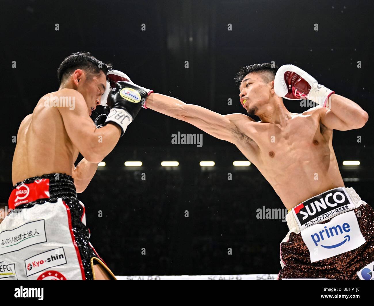 Junto Nakatani (white gloves) and Ryosuke Nishida (black globes ...