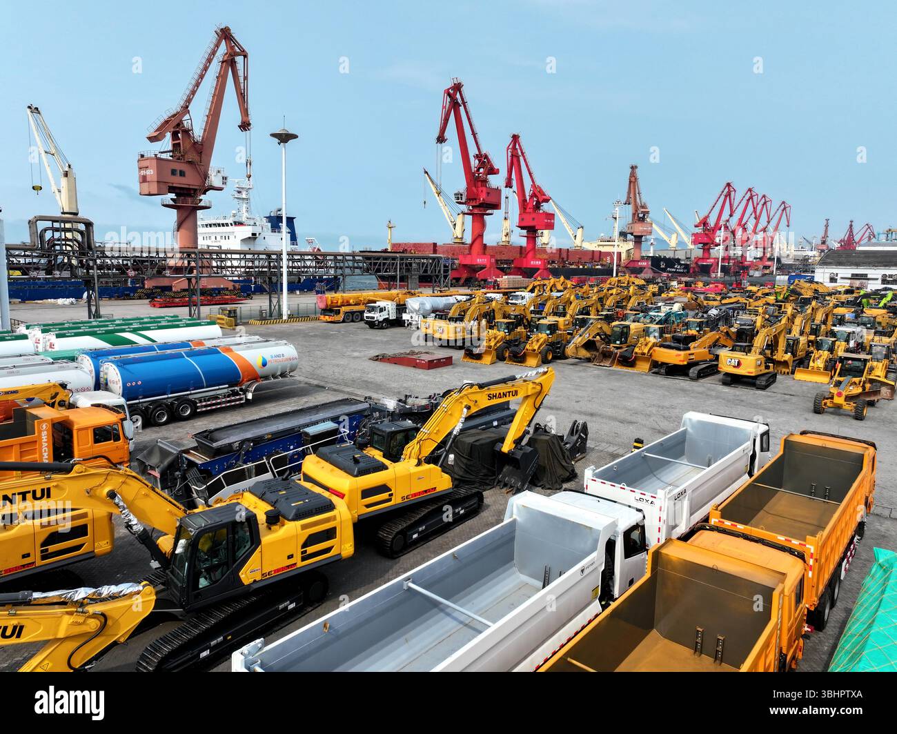 Aerial photo shows export-bound goods await loading at Lianyungang Port ...