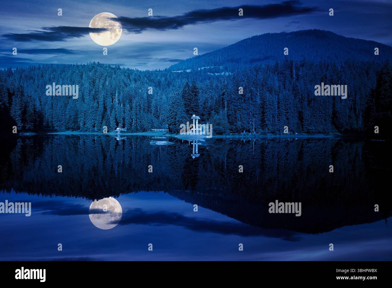 scenic landscape with lake among coniferous forest at night. air ...