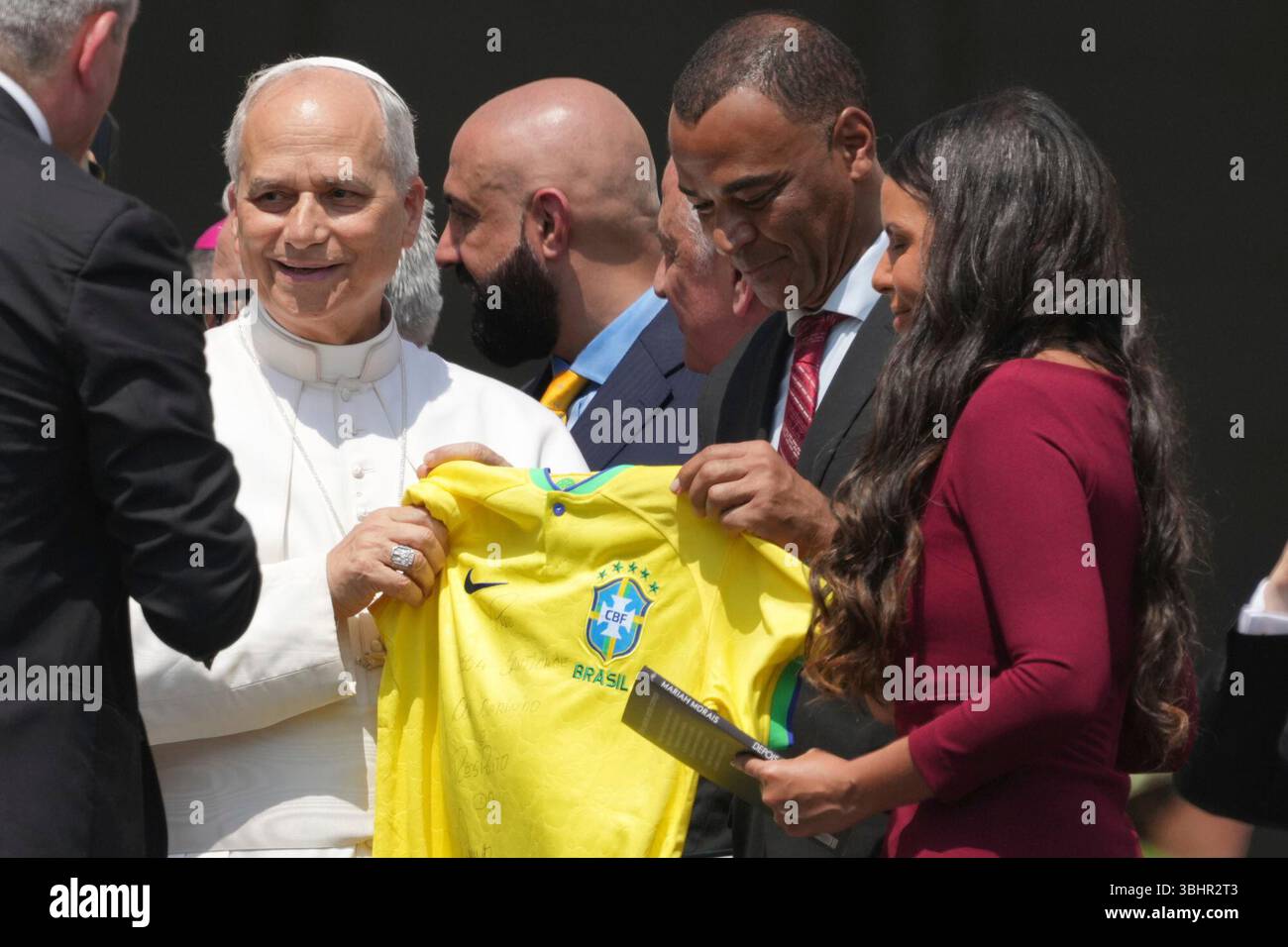 Pope Leo XIV receives a Brazilian national soccer shirt from former ...