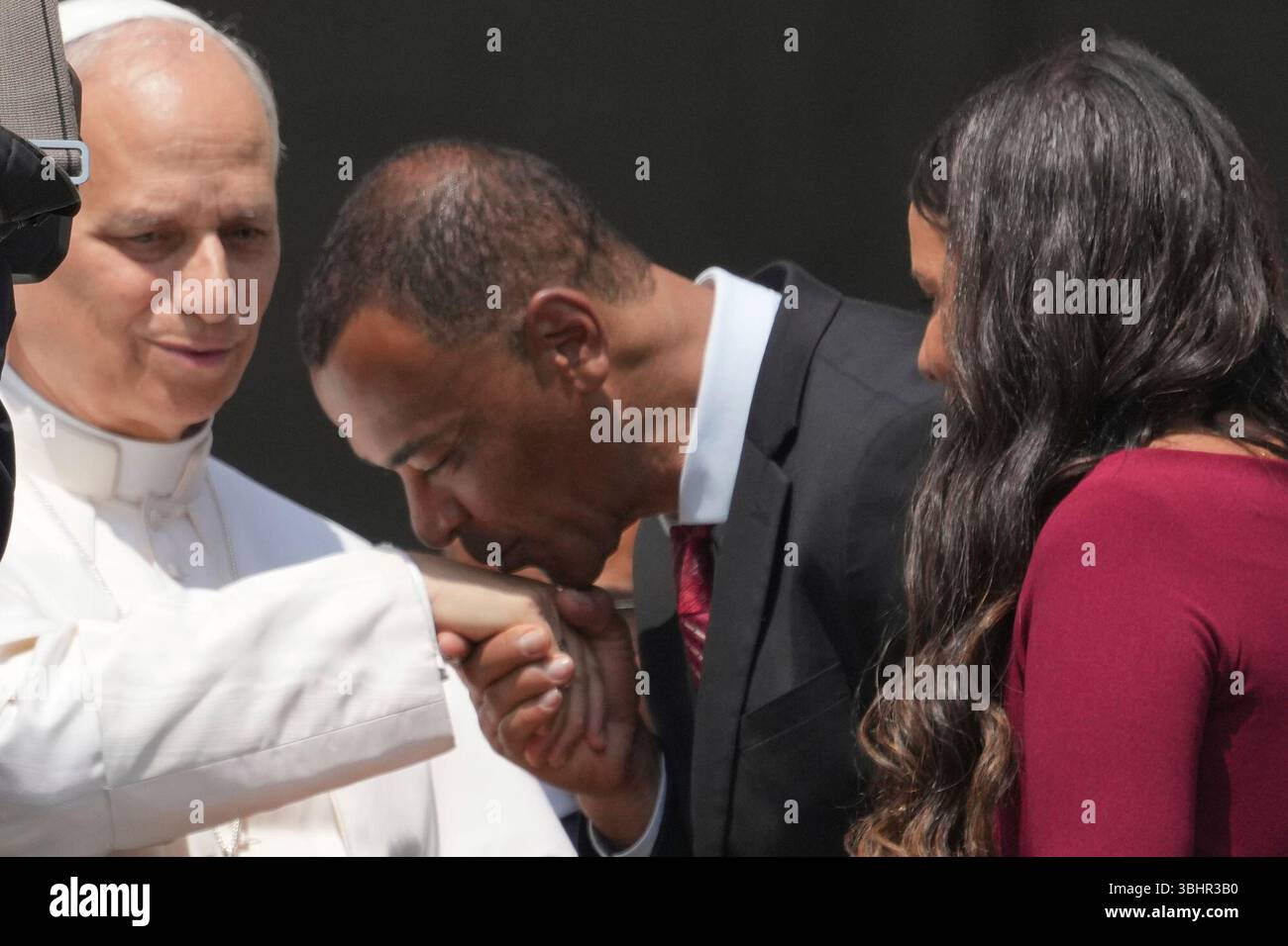 Brazilian former soccer player Cafu kisses the hand of Pope Leo XIV ...