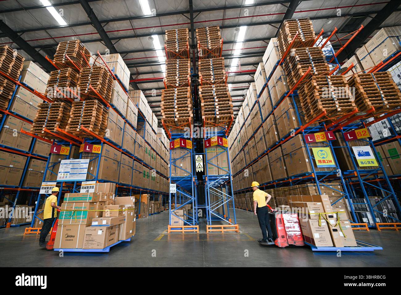 NANJING, CHINA - JUNE 11, 2025 - A worker is driving a forklift to ...