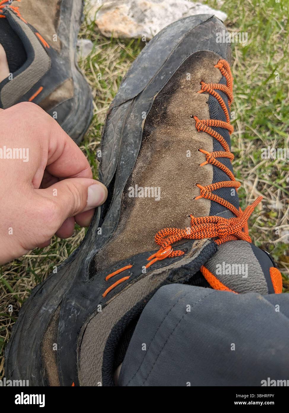 Old worn hiking boots with detached soles after challenging mountain ...