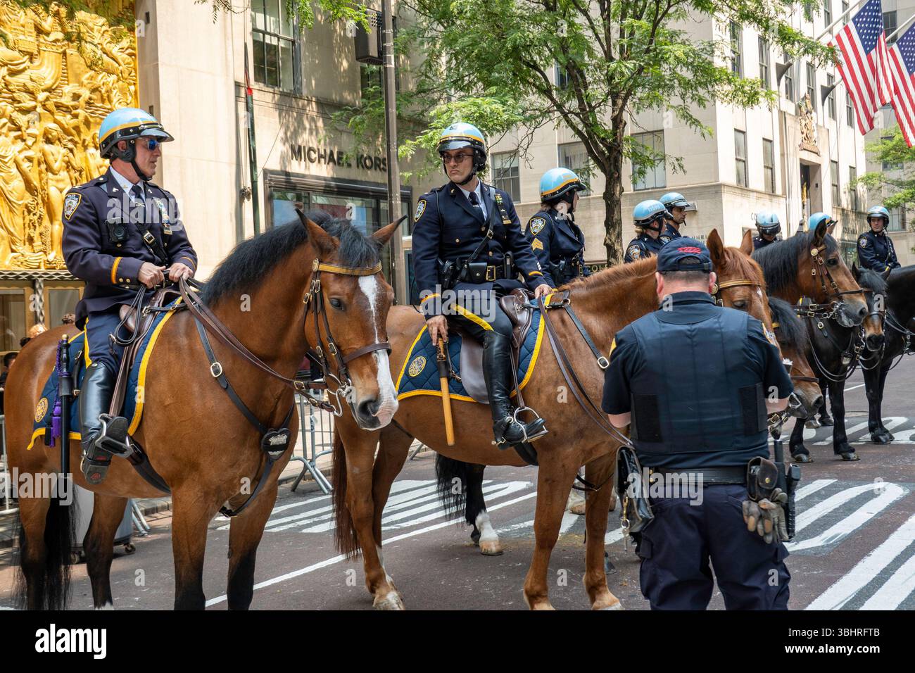 Police units gather on Fifth Avenue in honor of a fallen policeman at a ...