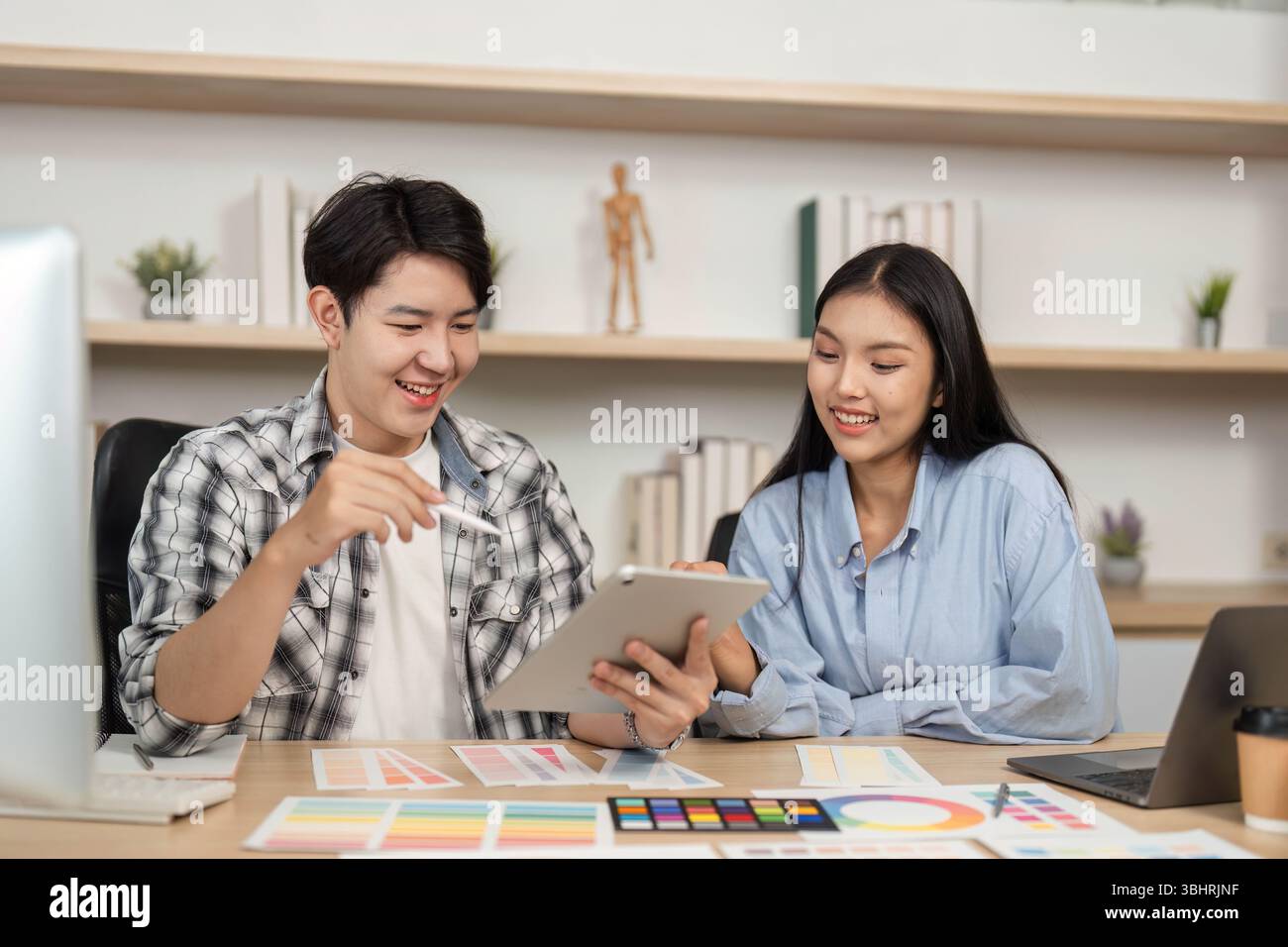 UX and UI Design Engagement. Young professionals reviewing design ...