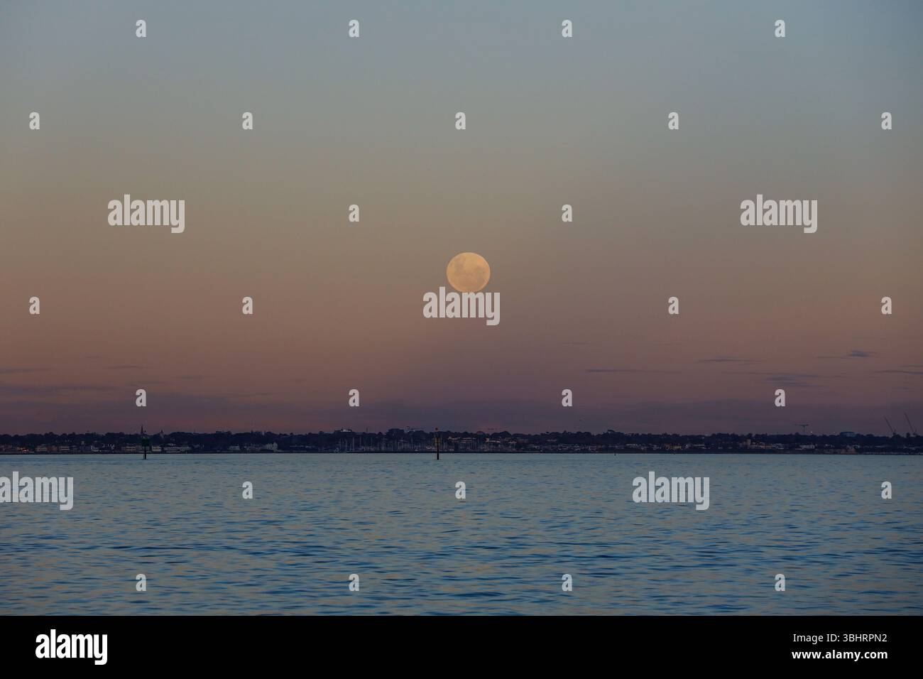 Melbourne, Australia. 11th June, 2025. A strawberry full moon rises ...