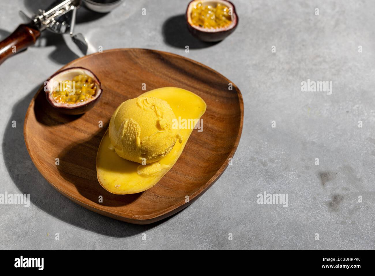 Mango and passion fruit ice cream ball Stock Photo - Alamy