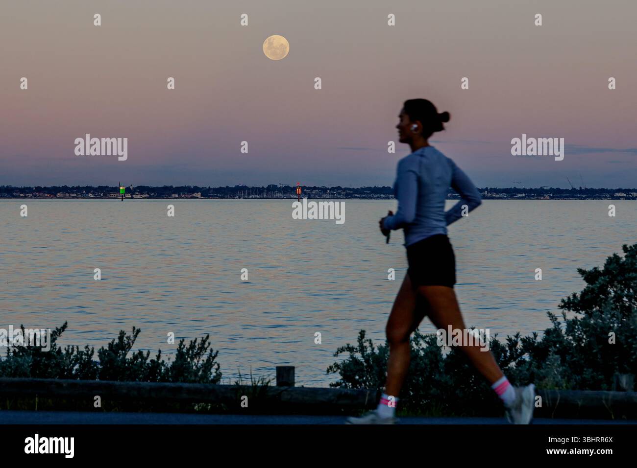 Melbourne, Australia. 11th June, 2025. A woman runs along Williamstown ...