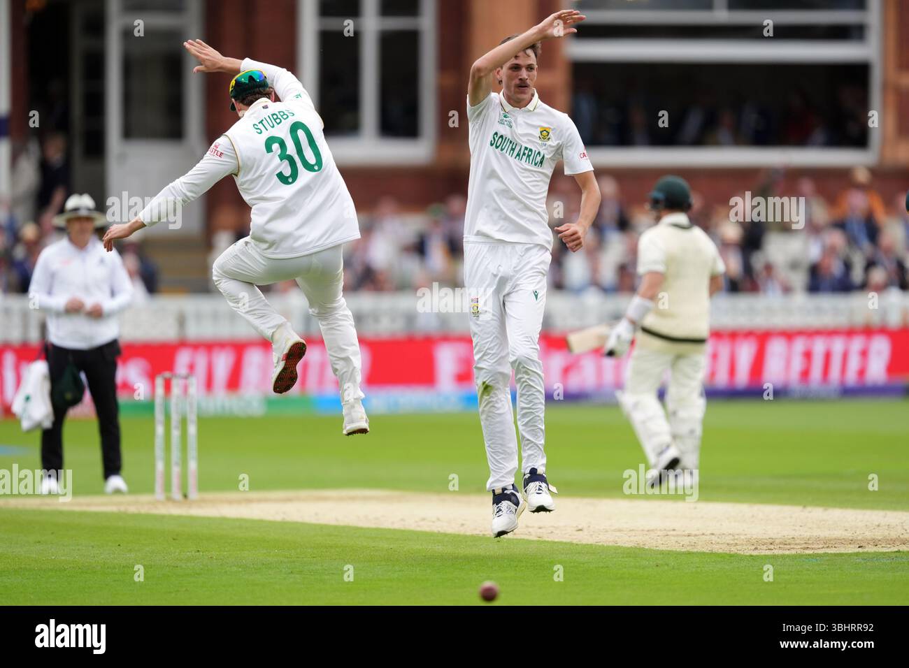 South Africa's Marco Jansen (right) celebrates the wicket of Australia ...