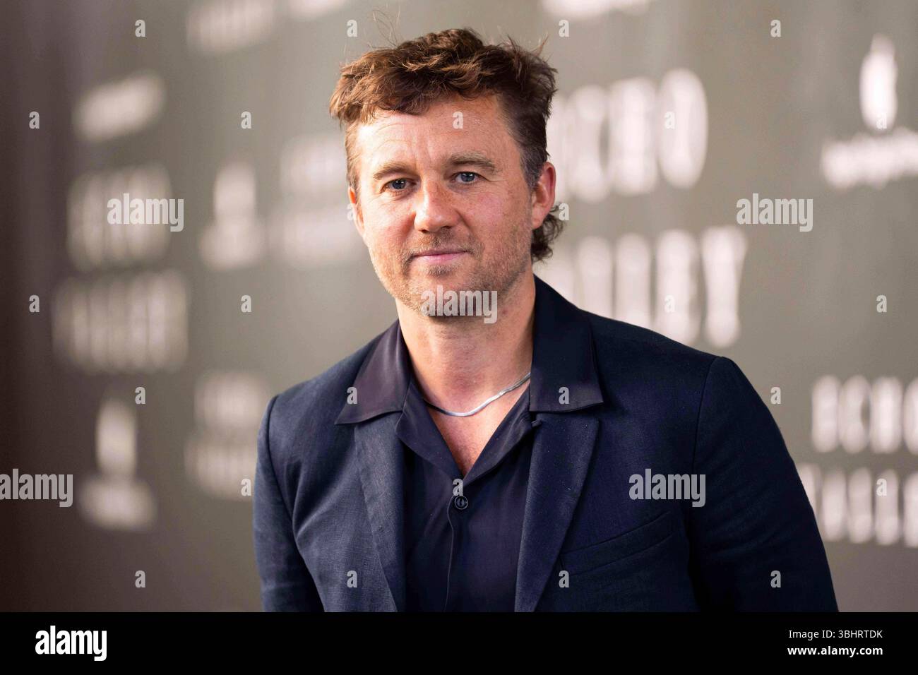 Director Michael Pearce poses for photographers upon arrival at the ...