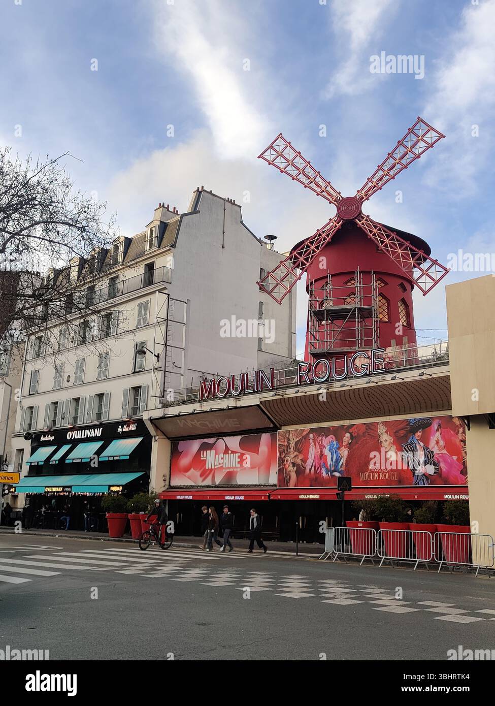 Paris, France - February 28, 2025: The iconic Moulin Rouge cabaret in ...