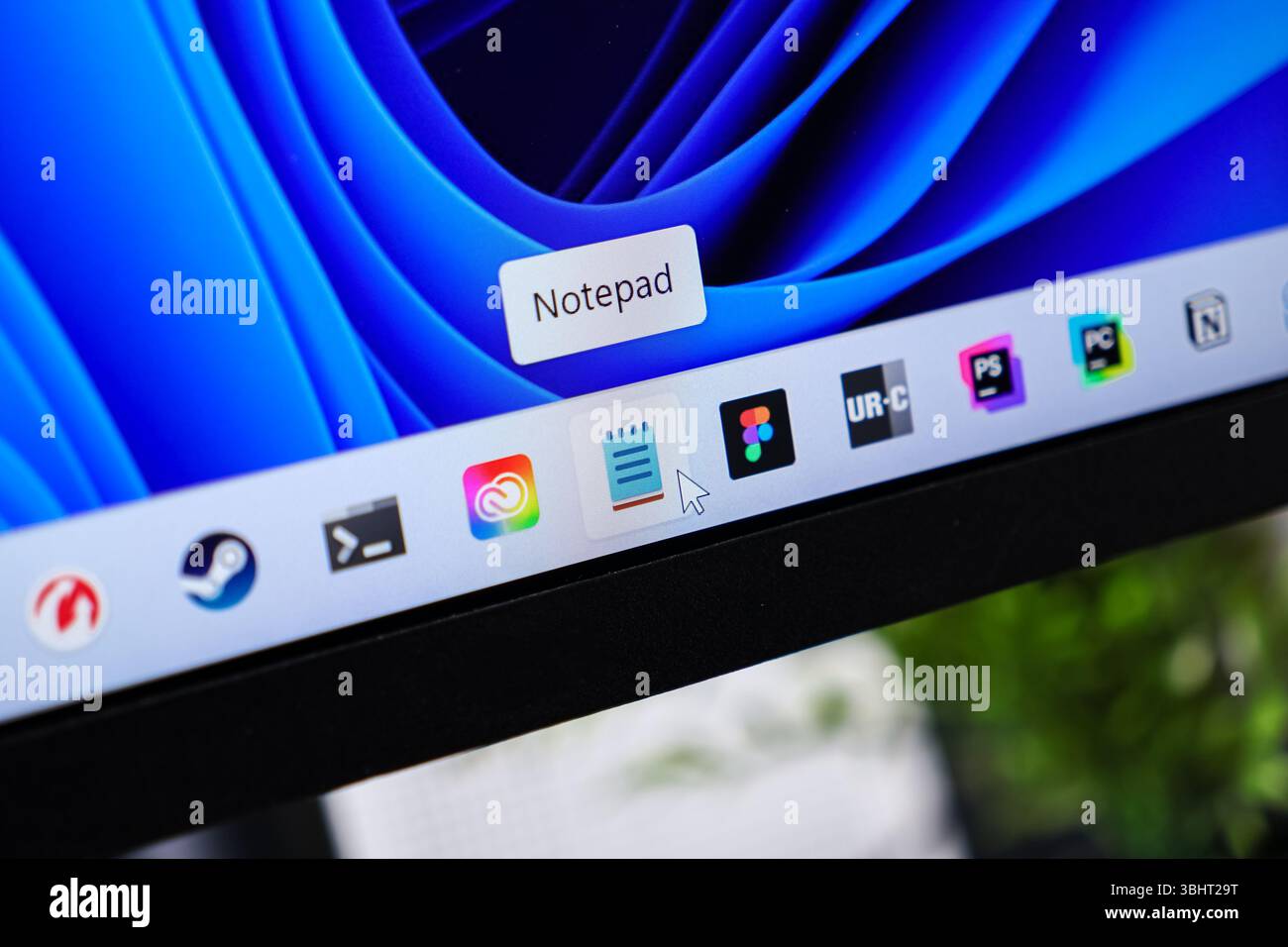 Poznan, Poland - June 6, 2025: Laptop screen shows Notepad application ...