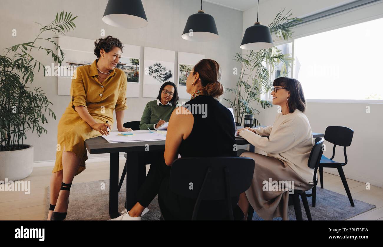 Professional women engage in a collaborative project management ...