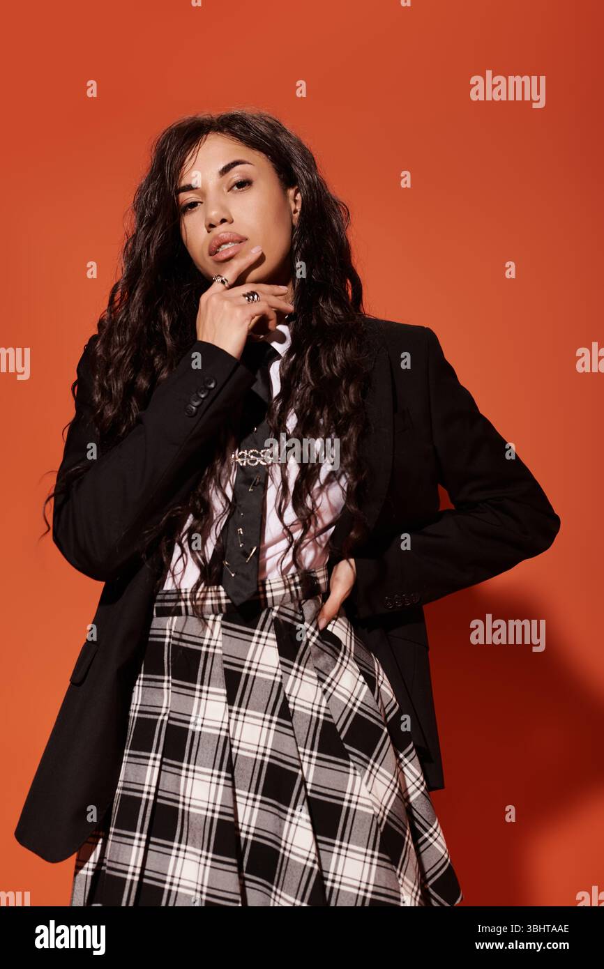 Beautiful young student poses confidently in stylish outfit, featuring ...