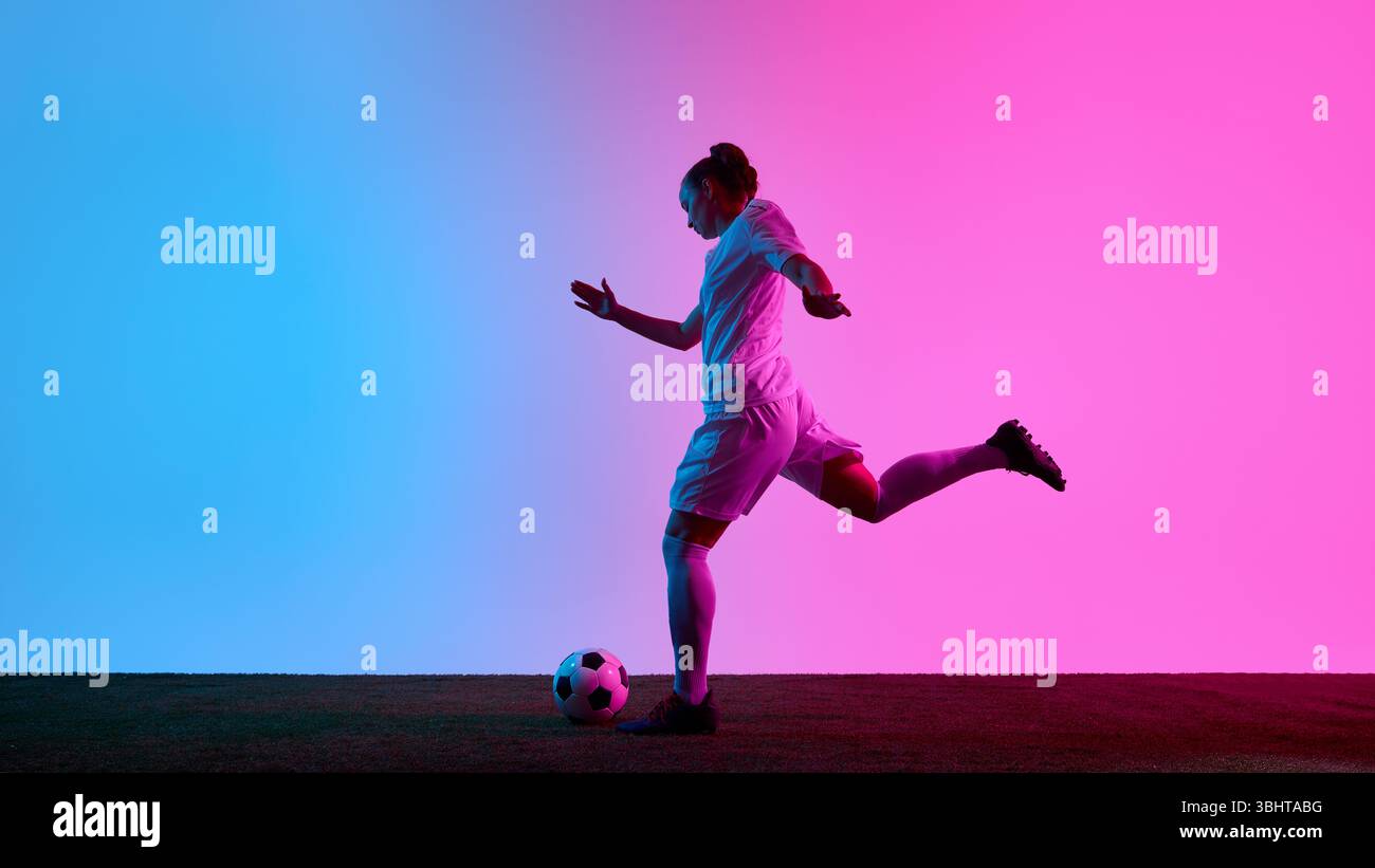 Female footballer mid action hi-res stock photography and images - Alamy