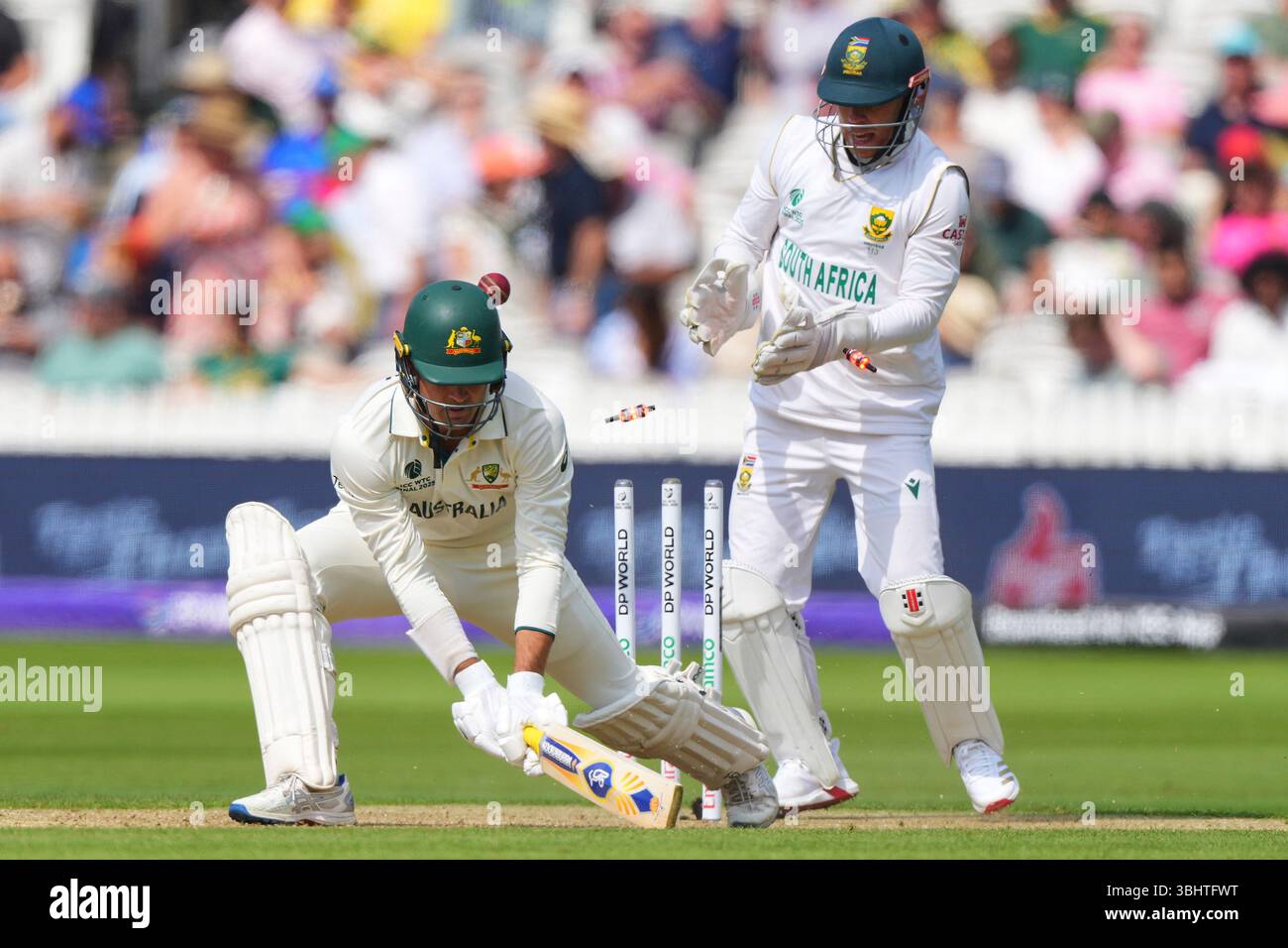 Australia's Alex Carey is bowled out by South Africa's Keshav Maharaj ...