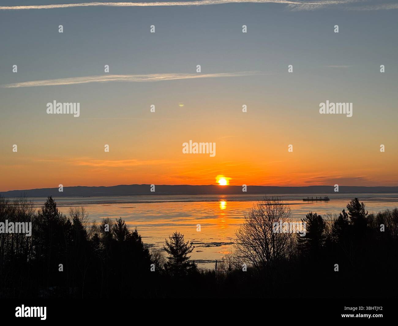 Sailing into the sunrise, Quebec, St. Lawrence River Stock Photo - Alamy