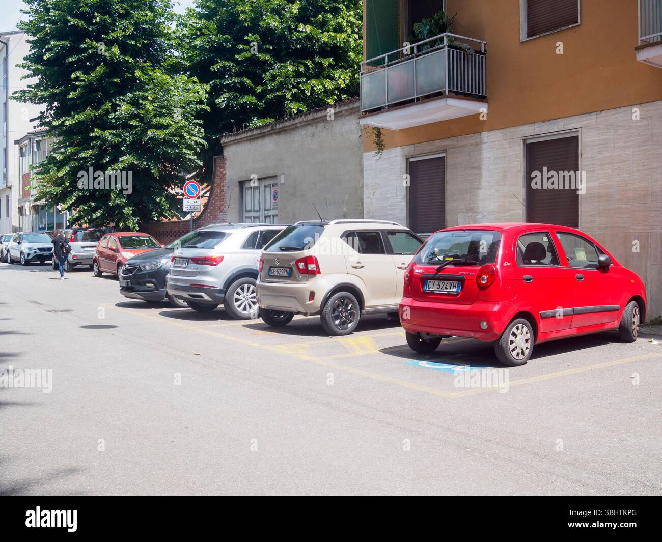 Cremona, Italy - June 2nd 2025 Parked cars filling nearly every ...