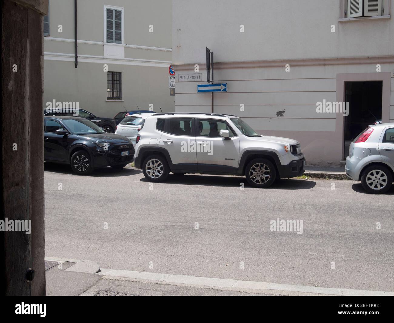 Cremona, Italy - June 2nd 2025 a white suv parked on a city street a ...
