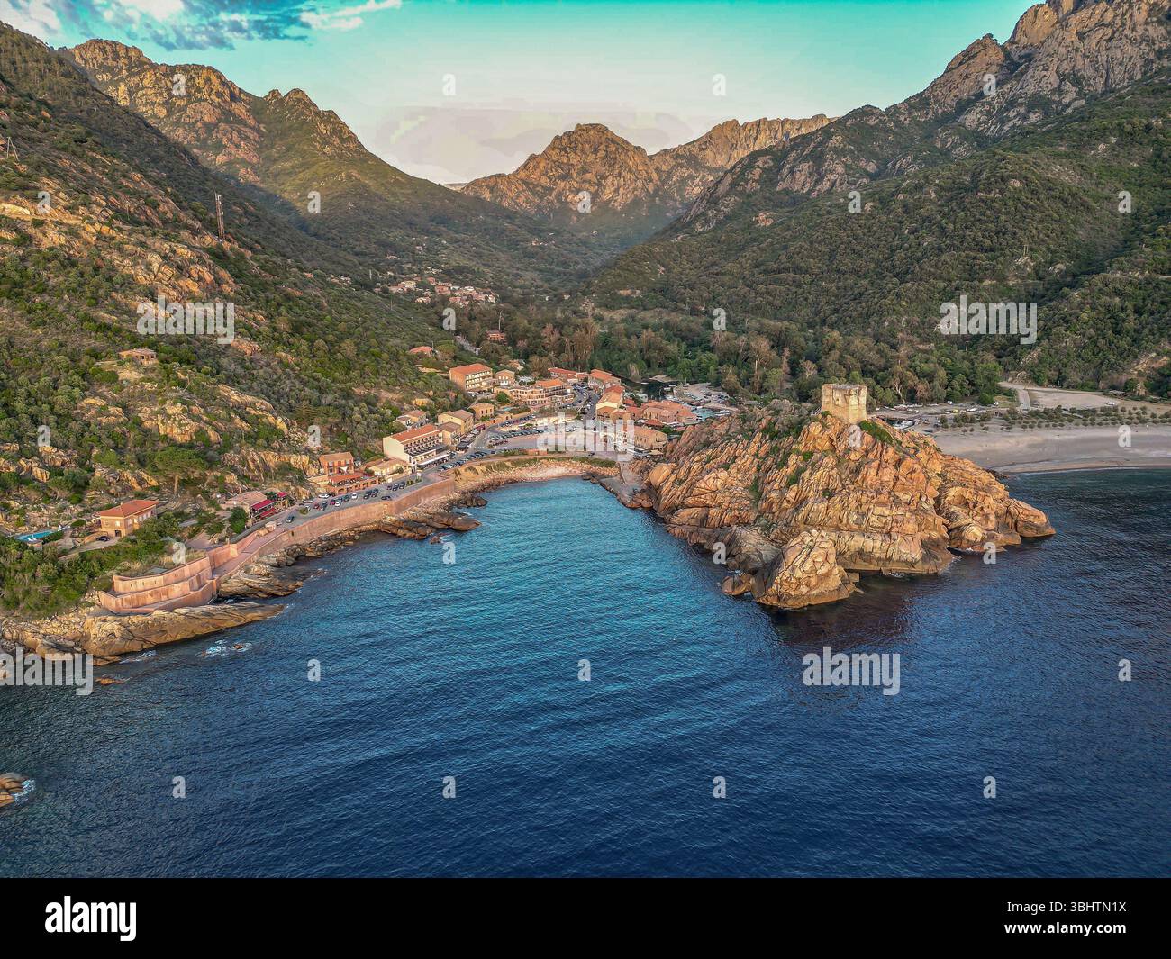 Aerial view town and ruins of the Genoese tower of Porto, Corsica ...