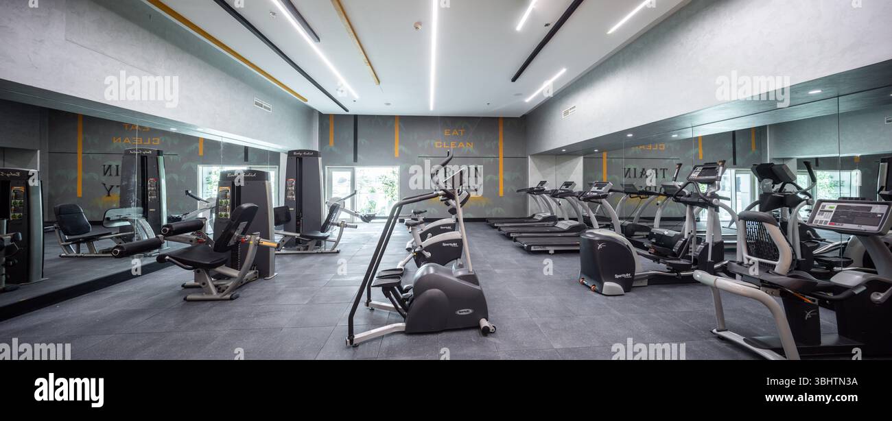 Panoramic Interior of apartment fitness center health club with ...