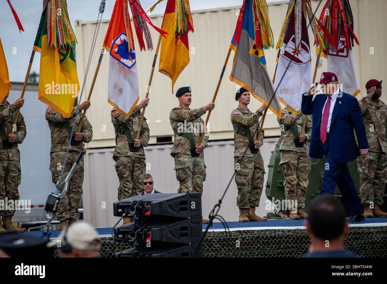 President Donald J. Trump salutes the color guard while walking on the ...