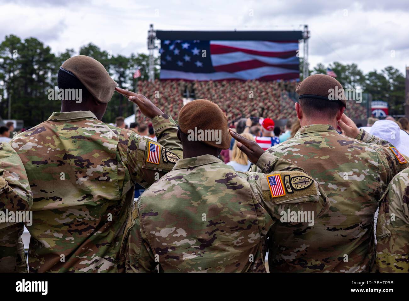 U.S. Army Soldiers salute the flag during the Army 250 celebration at ...
