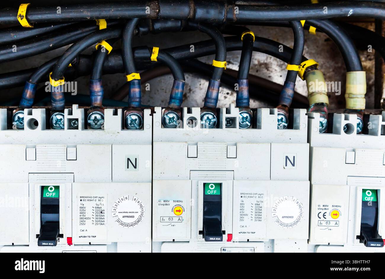 Electric cables connected to a distribution block with switches, close ...