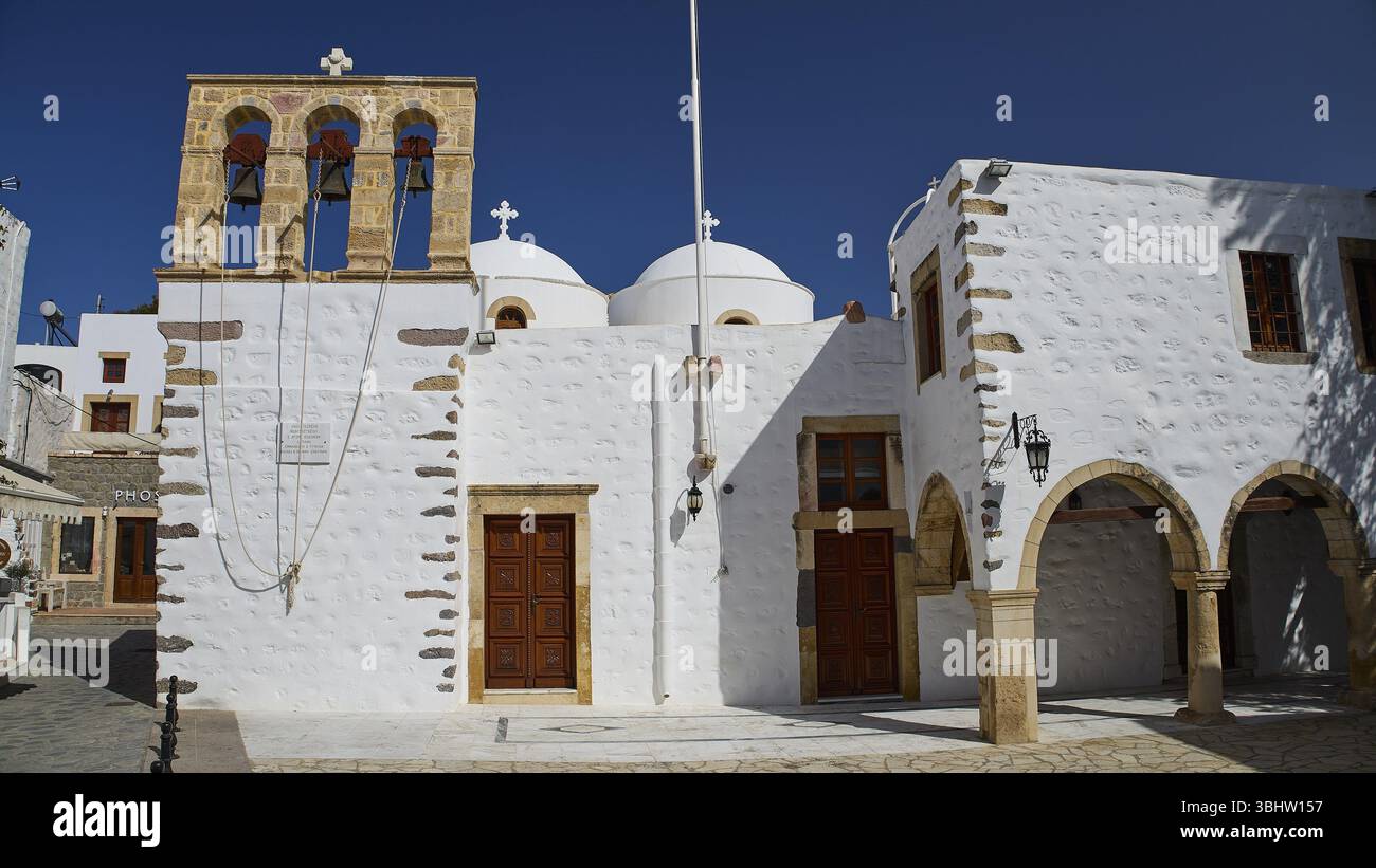Church of Agios Ioannis Prodromos, white church with bell tower under a ...