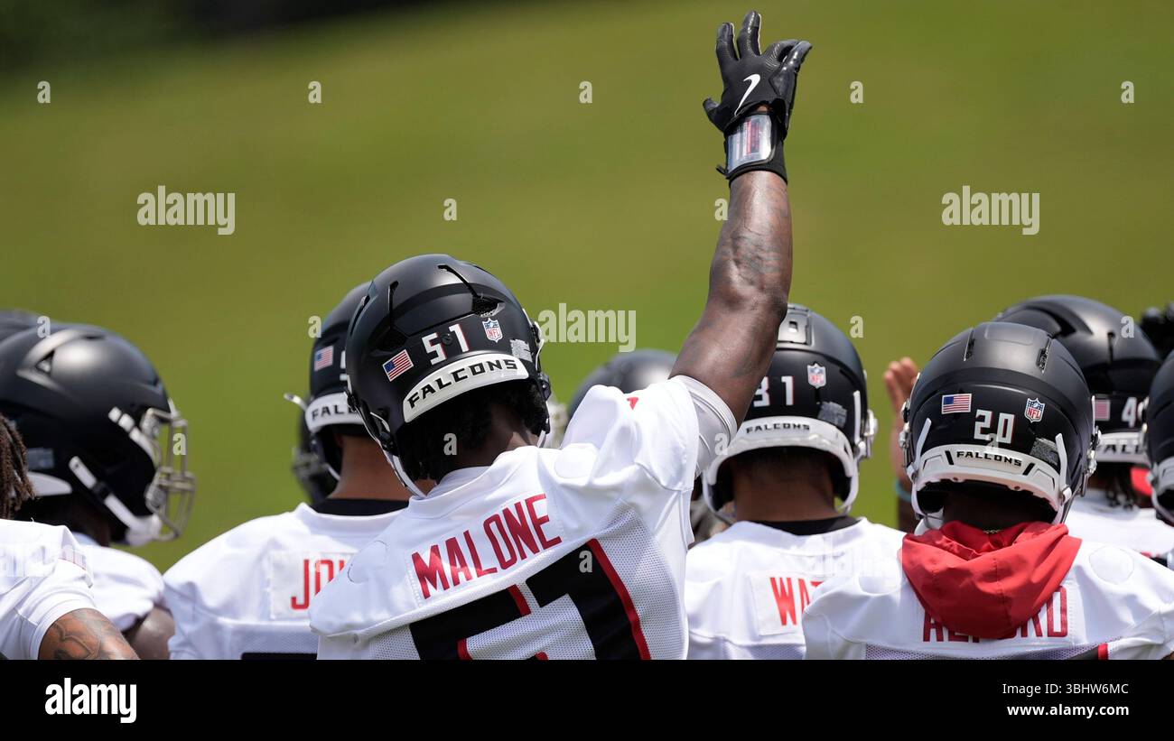 The Atlanta Falcons huddle during practice at NFL football minicamp ...