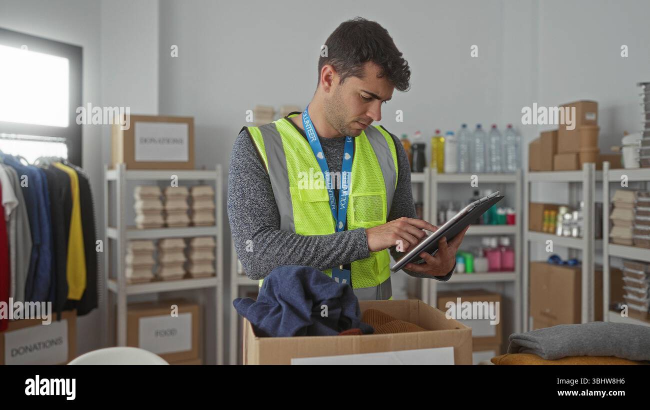 Man holds tablet when checking items in center where hispanic young ...