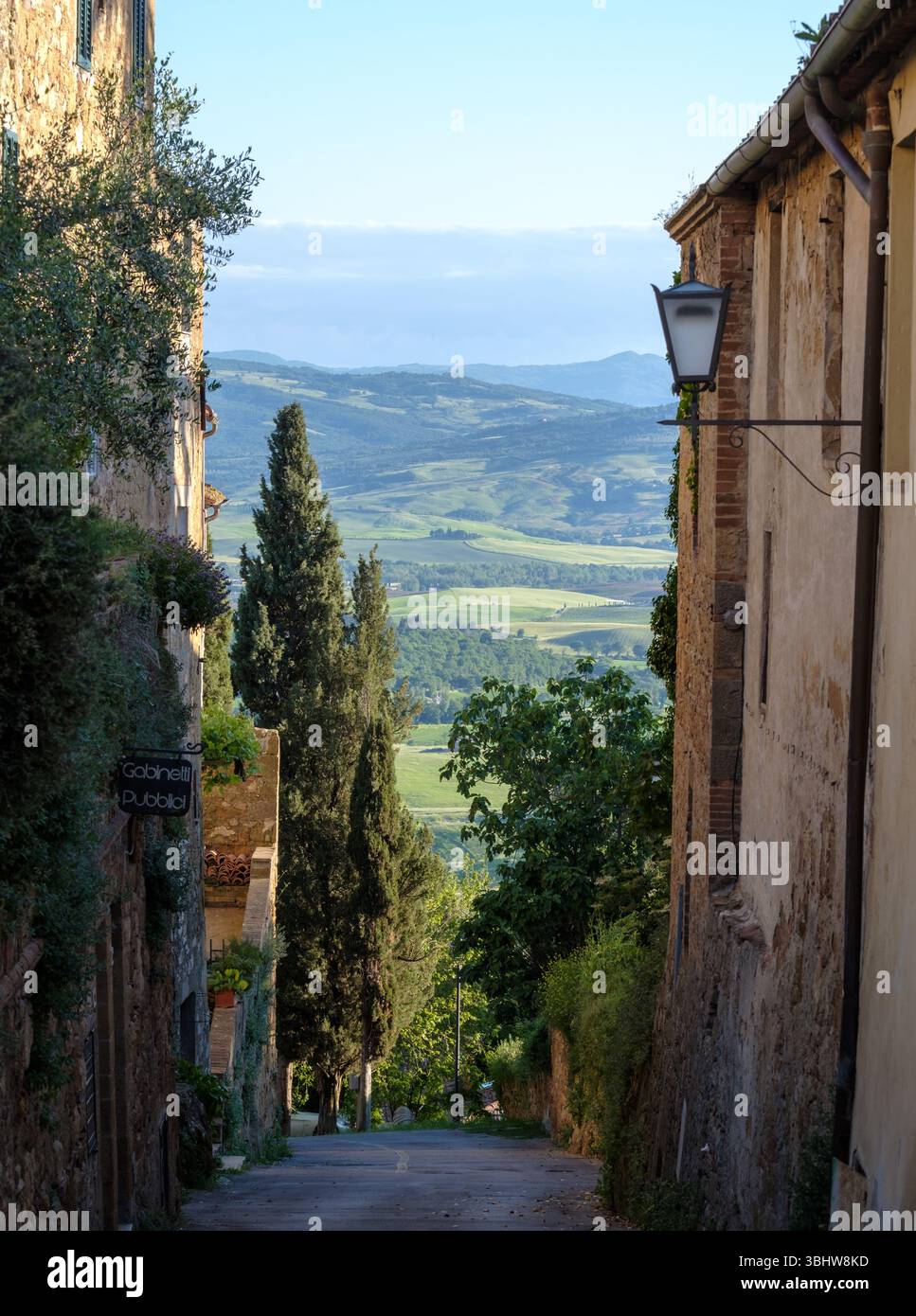 View through a narrow hilltop street of the green agricultural ...