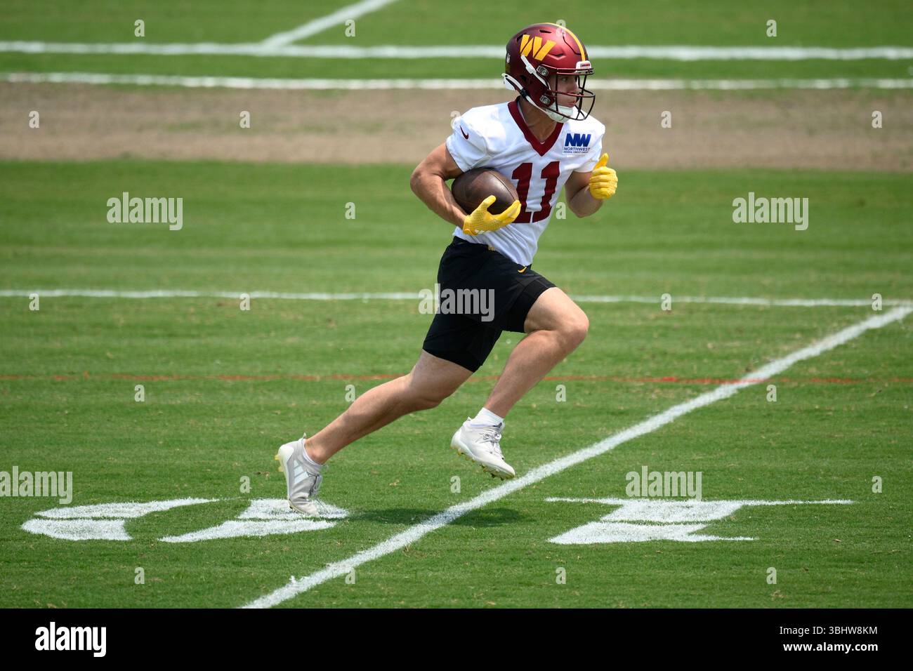 Washington Commanders wide receiver Luke McCaffrey (11) works out ...