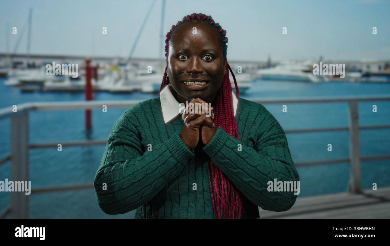 Woman with braided hair expresses surprise at a port with boats in the ...