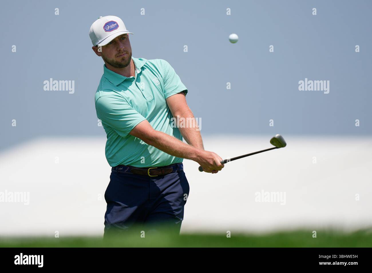 Alistair Docherty chips onto the third hole during a practice round ...