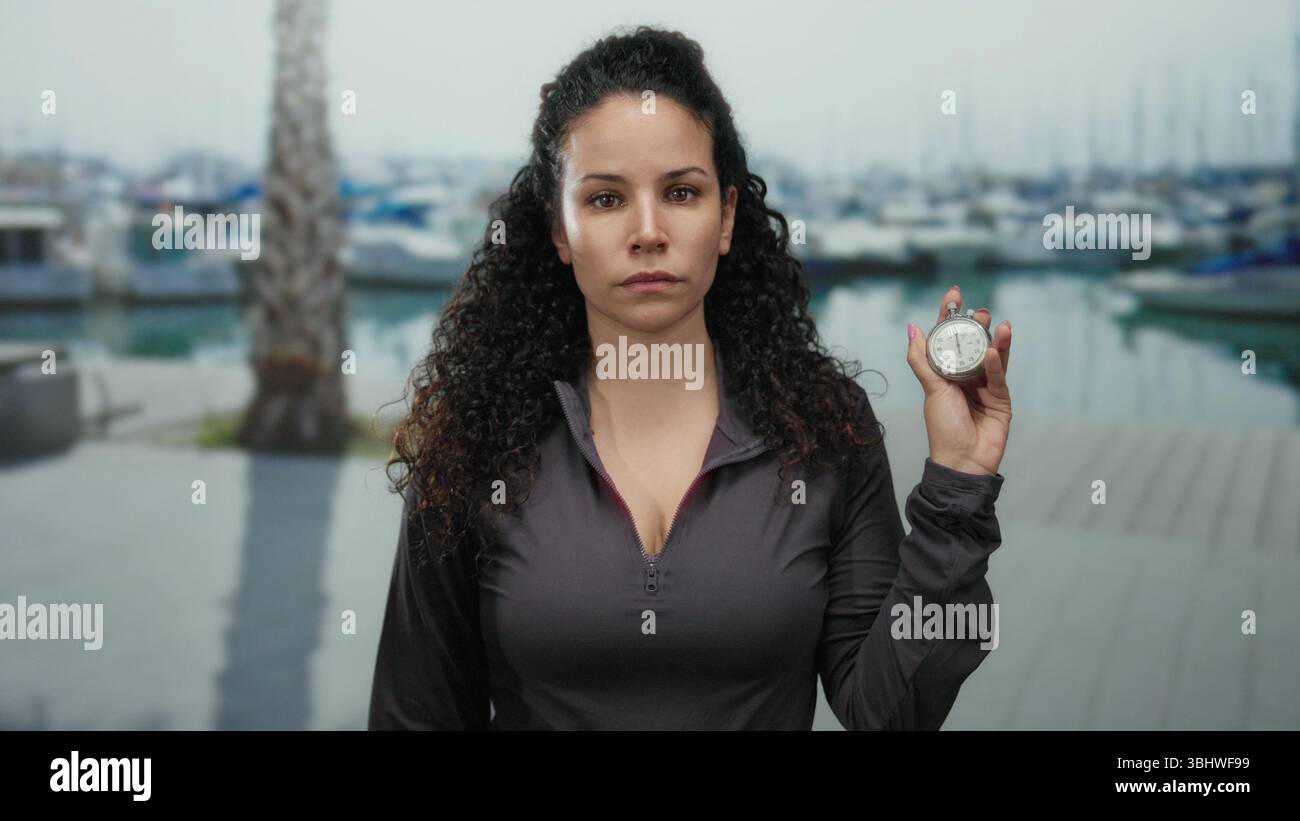 Woman holding stopwatch seaside port hi-res stock photography and ...