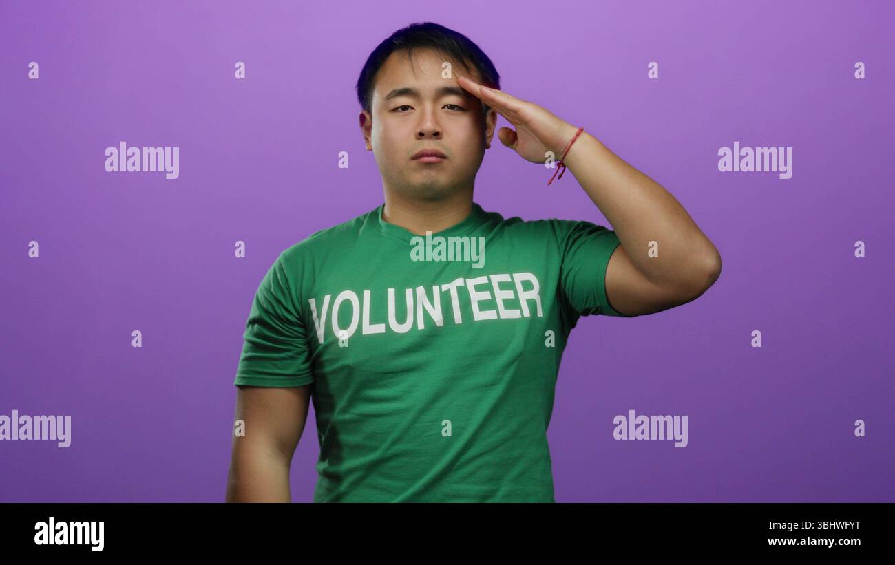 Man saluting against purple background hi-res stock photography and ...