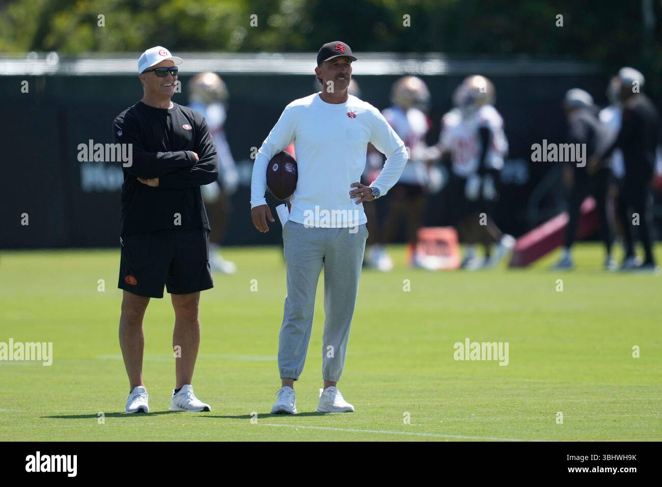 San Francisco 49ers general manager John Lynch, left, and head coach ...