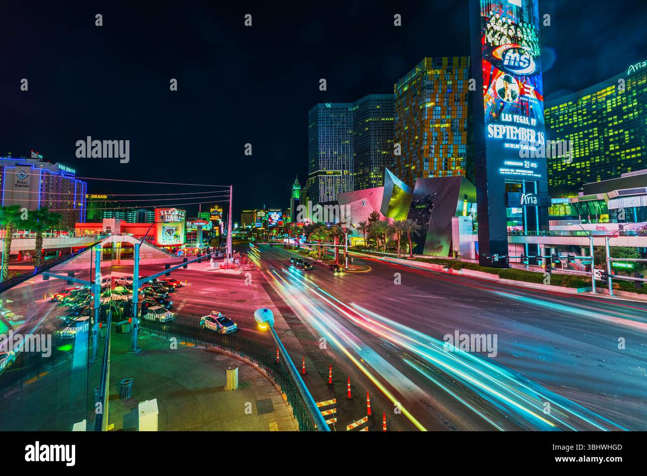 Colorful night view of Las Vegas Strip with motion blur lights, luxury hotels and Aria Resort ...