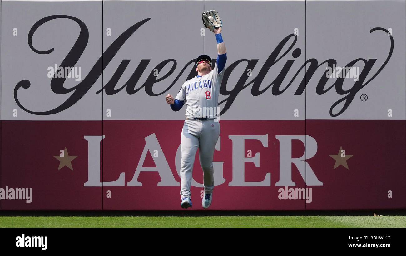 Chicago Cubs left fielder Ian Happ catches a fly out hit by ...