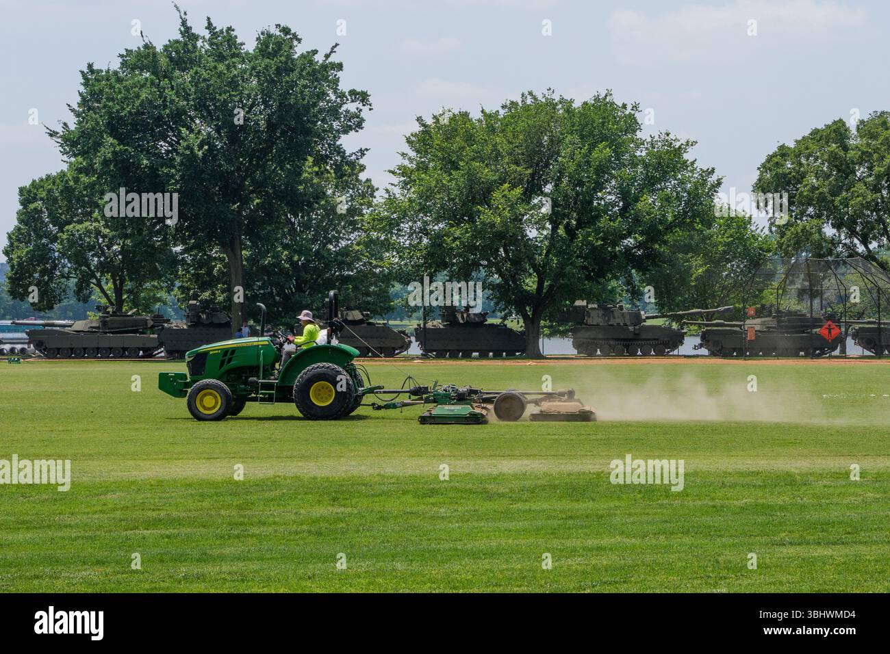 Washington, United States. 11th June, 2025. A landscaper mows the grass ...