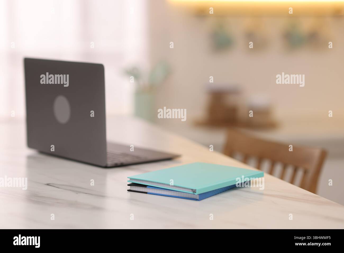 Notebooks on counter in hi-res stock photography and images - Alamy