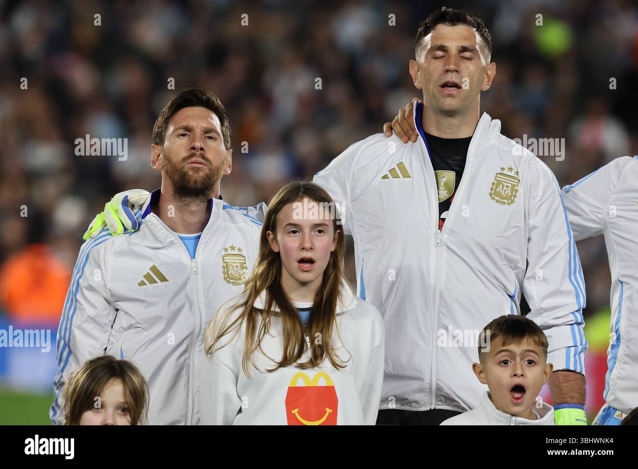 Argentinas national team forward Lionel Messi L and goalkeeper Emiliano ...