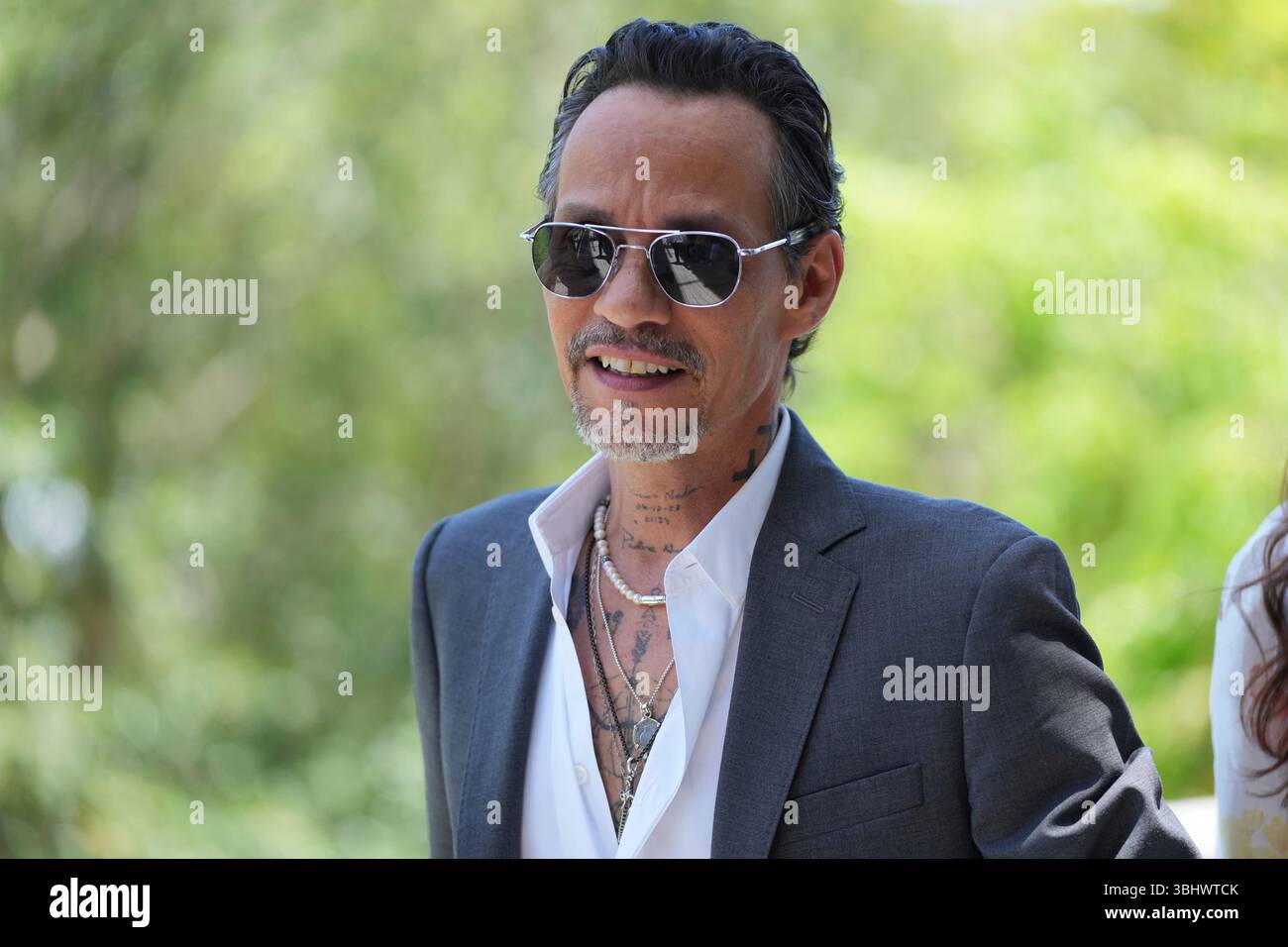 Singer Marc Anthony listens to speakers during a FIFA One Year to Go ...